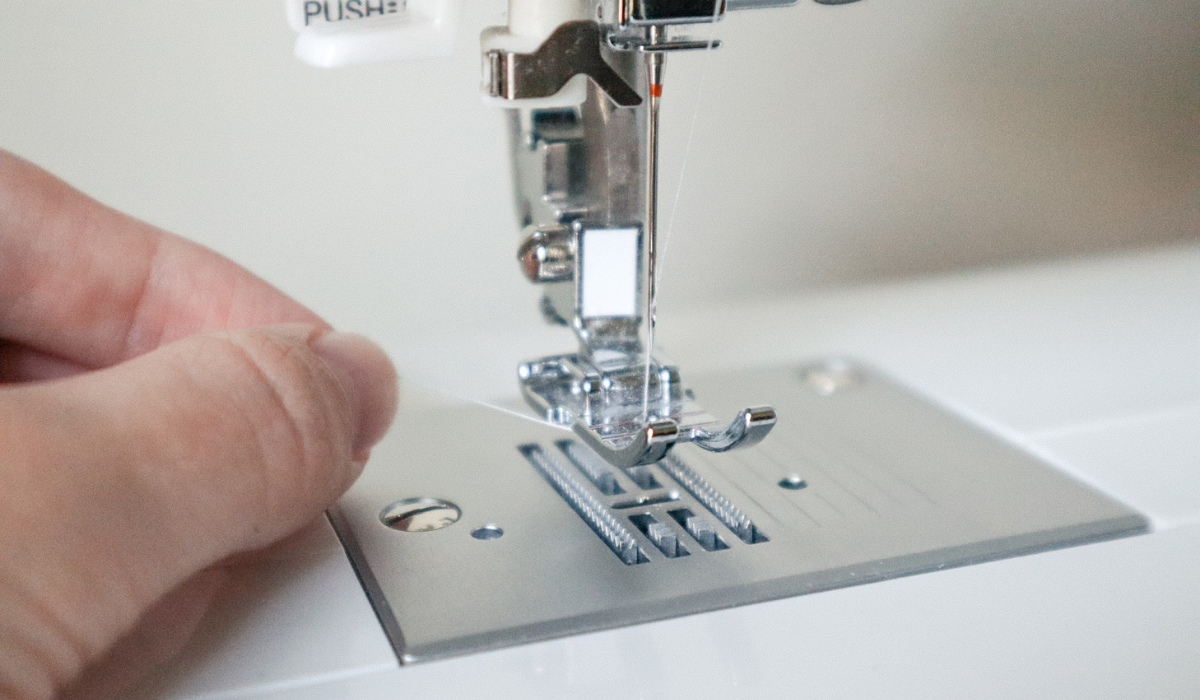 How to Thread a Singer Tradition Sewing Machine - Hailey Stitches