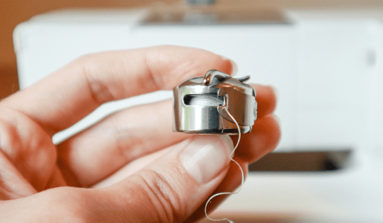 How to Wind and Insert a Bobbin into a Singer Tradition Sewing Machine ...