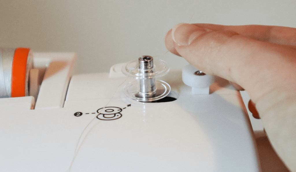 How to Wind and Insert a Bobbin into a Singer Tradition Sewing Machine ...