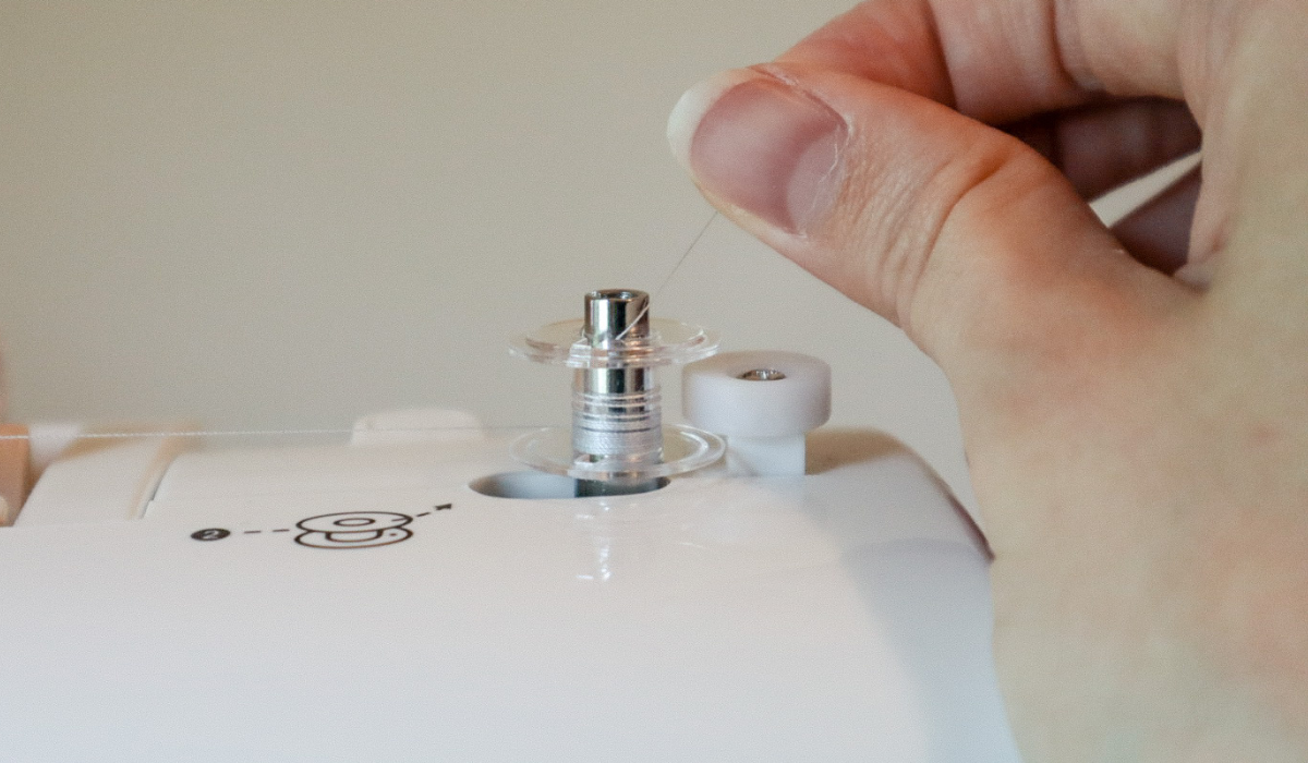 How to Wind and Insert a Bobbin into a Singer Tradition Sewing Machine ...