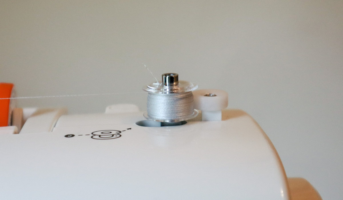 How to Wind and Insert a Bobbin into a Singer Tradition Sewing Machine ...