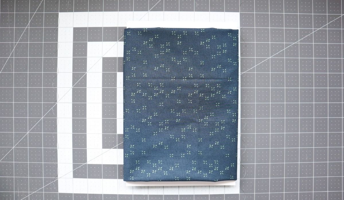 How to Fold Fabric on Comic Book Boards - Hailey Stitches