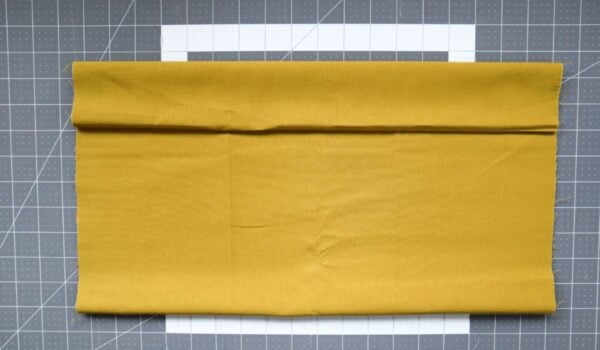 How to Fold Fabric on Comic Book Boards - Hailey Stitches